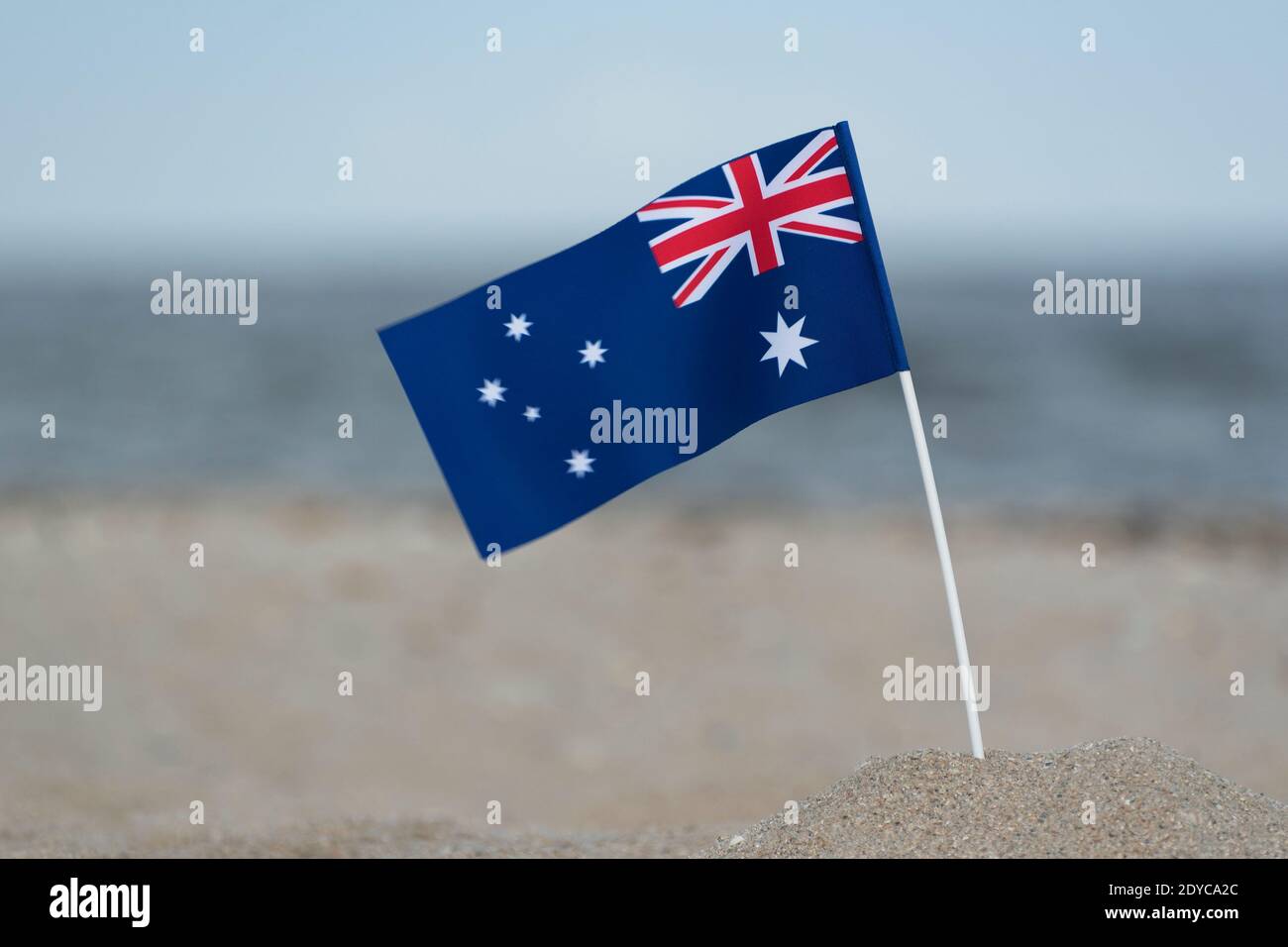 Australian flag in sand on the beach. Seaside holiday in Australia ...