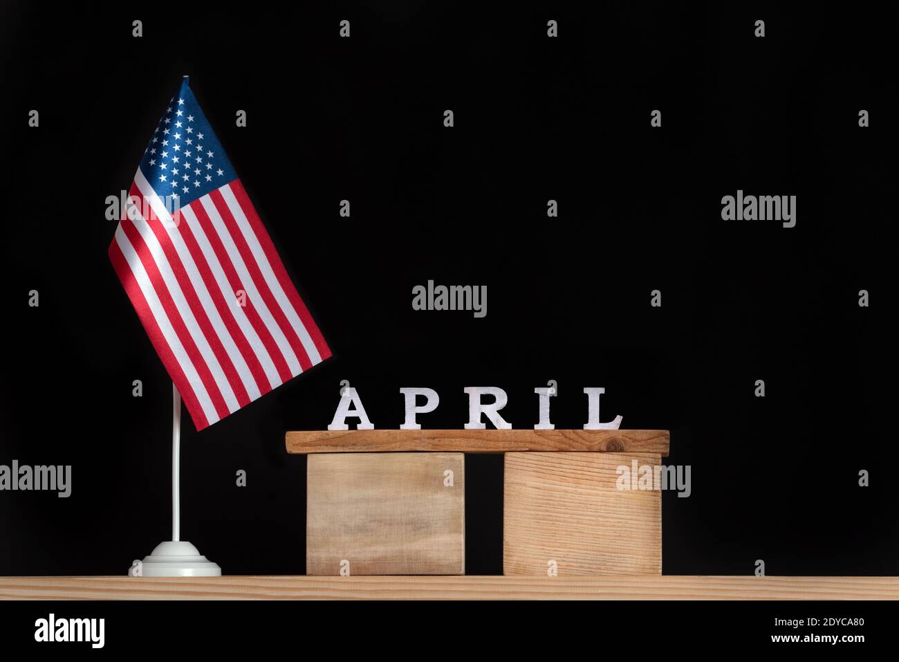Wooden calendar of April with USA flag on black background. Holidays of ...