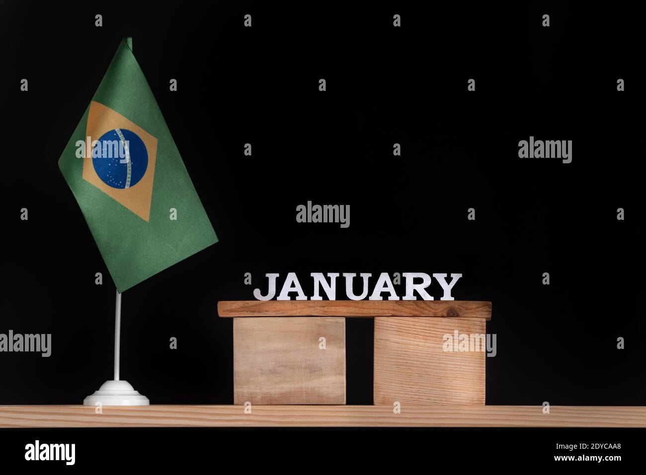 Wooden calendar of January with Brazilian flag on black background ...