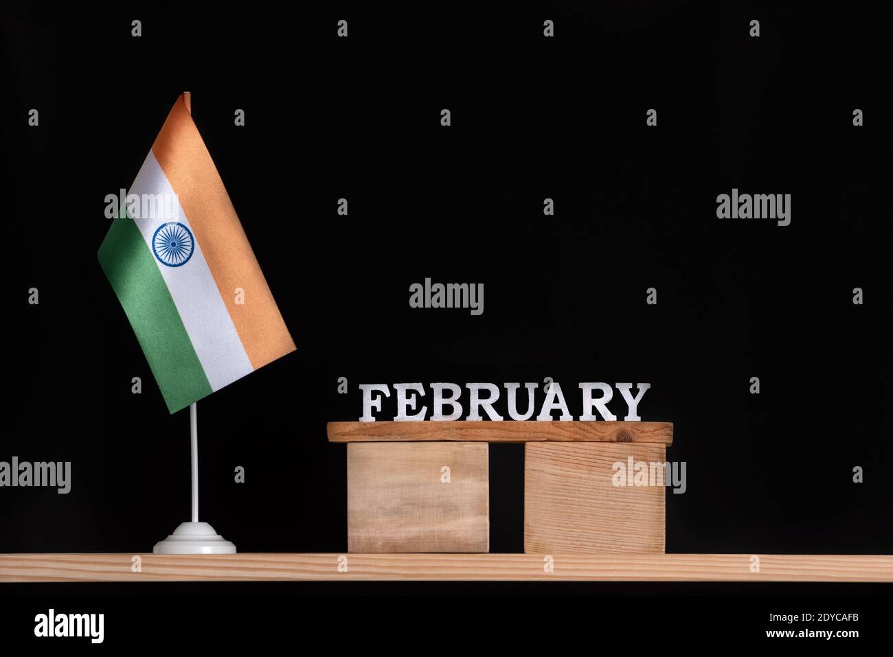 Wooden calendar of February with Indian flag on black background ...