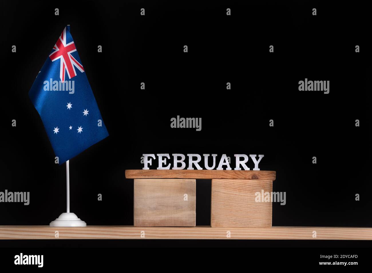 Wooden calendar of February with Australian flag on black background ...
