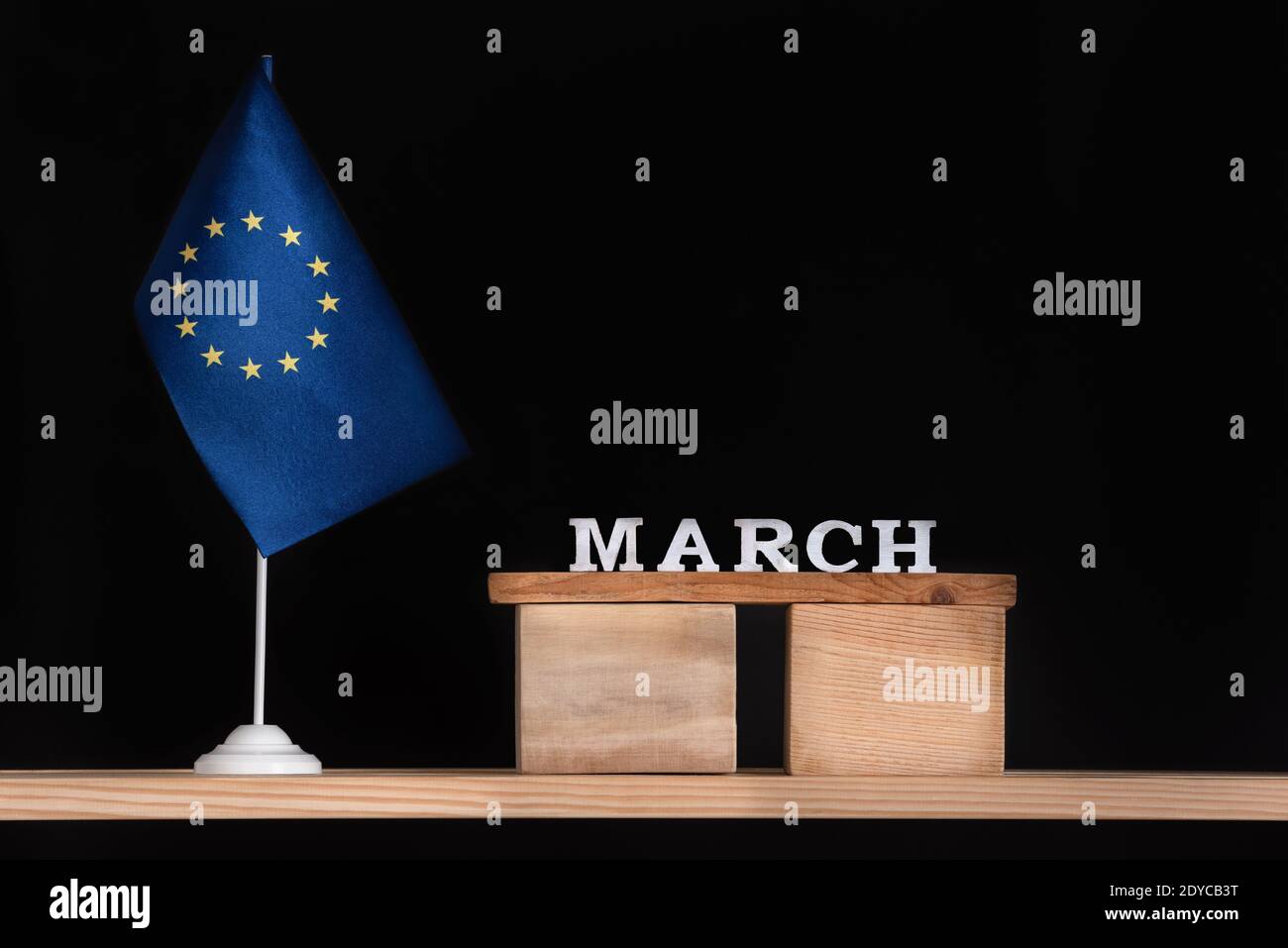 Wooden calendar of March with flag EU on black background. Holidays of ...