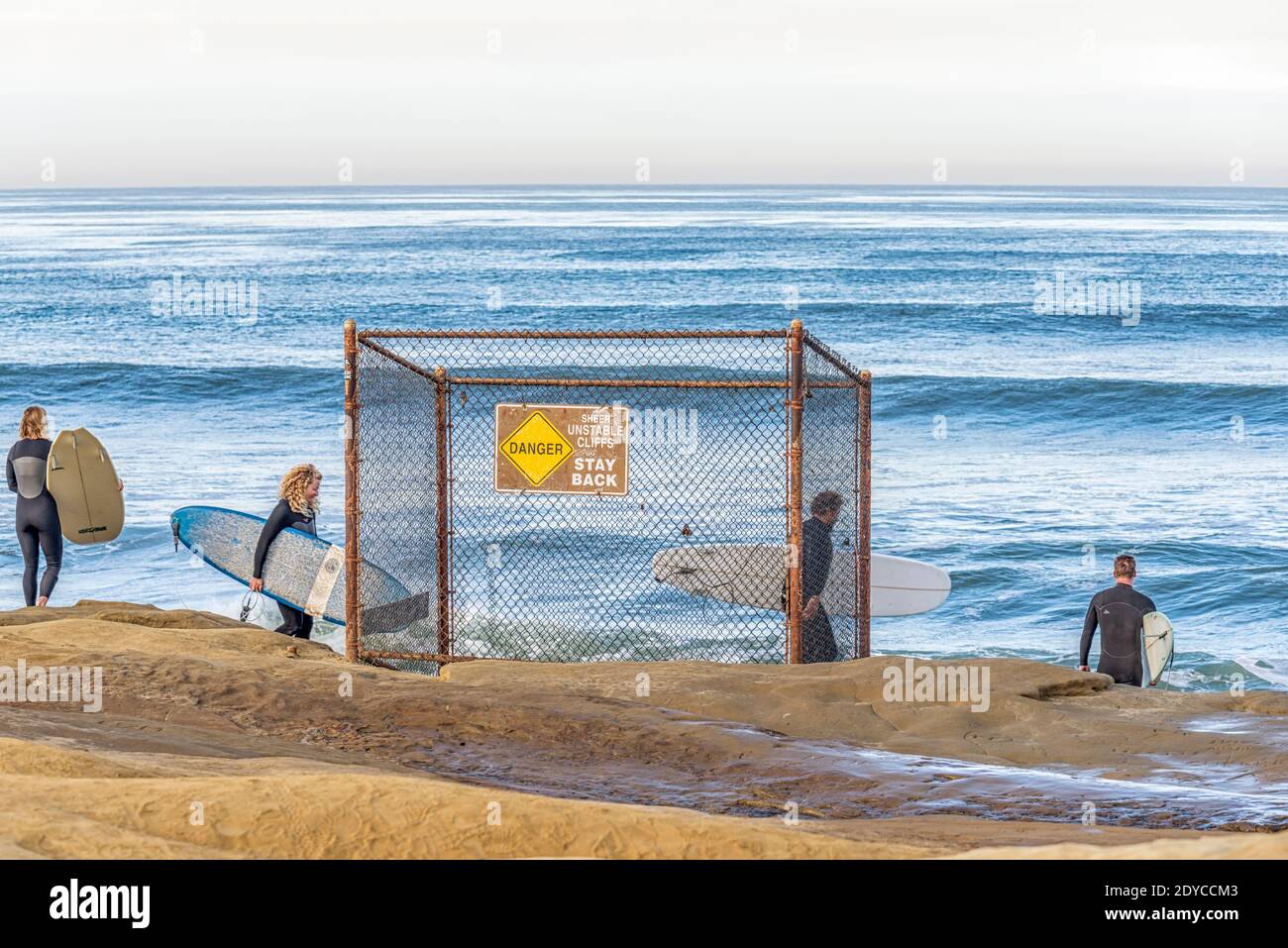 Surfers at Sunset Cliffs Natural Park on a winter morning. San Diego ...