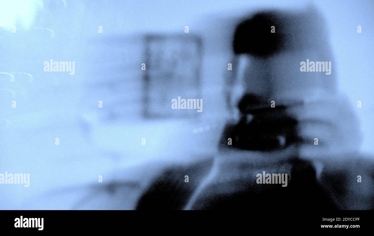 Artistic blurred photo of a photographer taking a selfie in the mirror ...