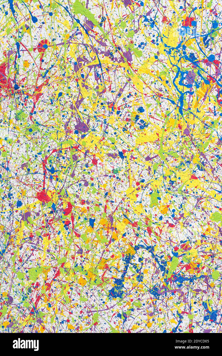 Background with multicolored splashes of paint on the wall. Vertical ...