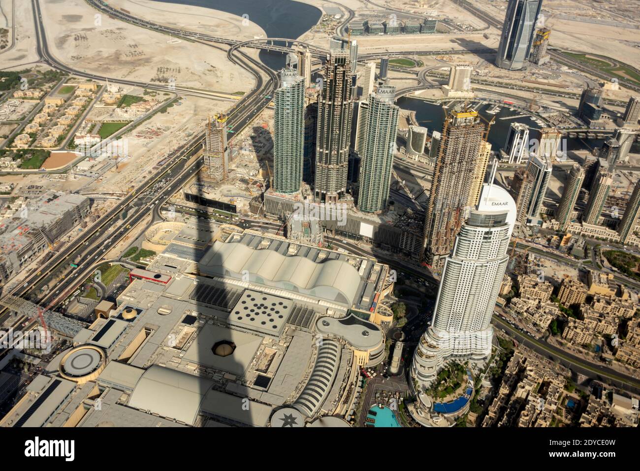 Shadow of the Burj Kalifa on the Dubai Shopping Mall and skyscrapers ...