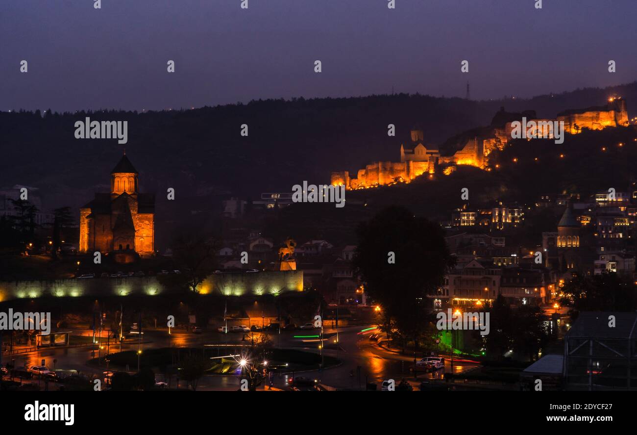 Metekhi cathedral and Narikala castle at foggy night as a one of the ...