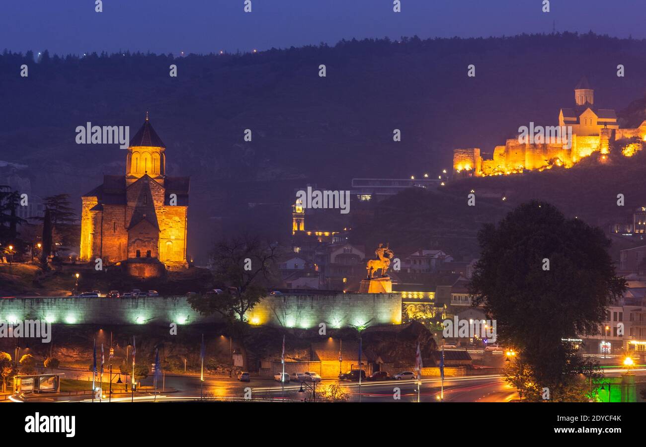 Metekhi cathedral and Narikala castle at foggy night as a one of the ...
