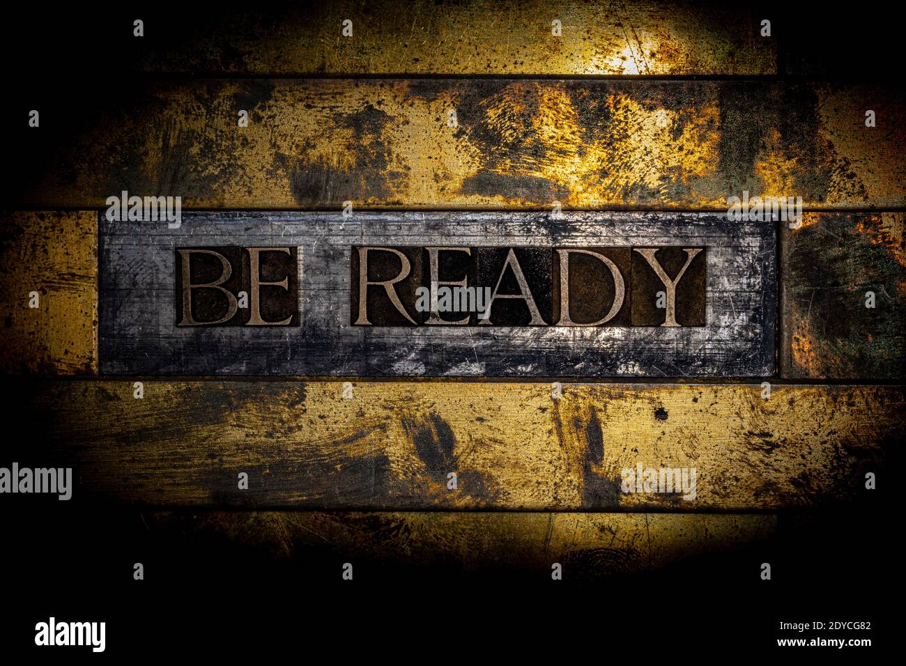 Be Ready text message on textured grunge copper and vintage gold ...