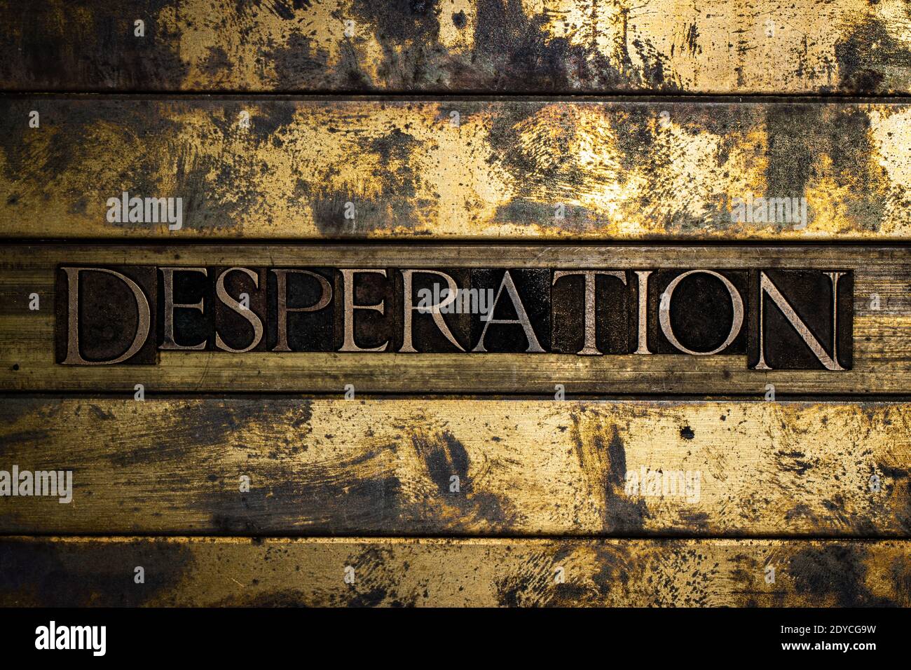 Desperation text on vintage grunge textured copper and gold background ...