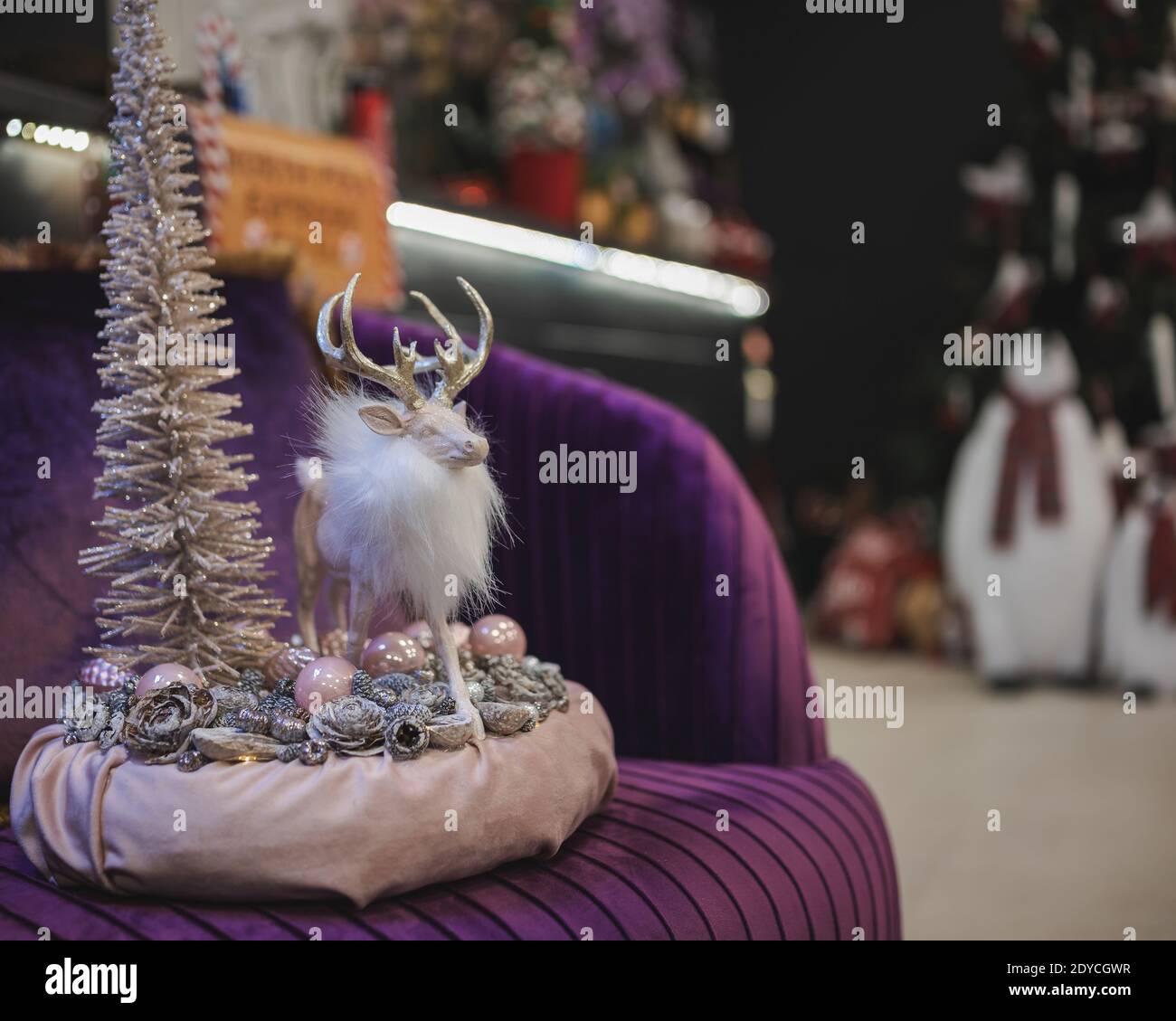 A unique Christmas decoration with a reindeer figurine Stock Photo - Alamy