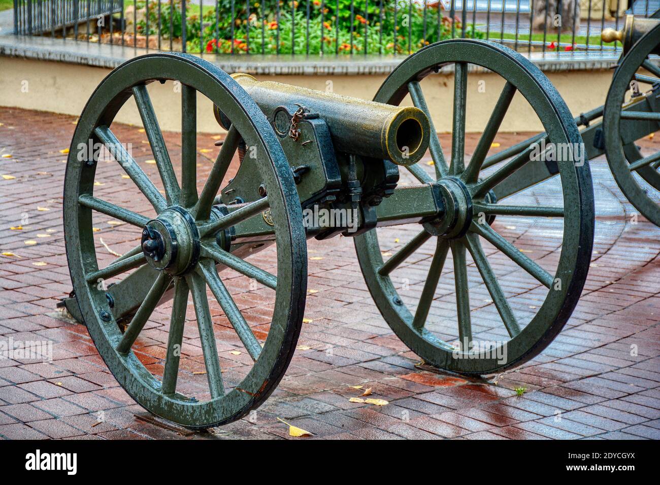 An old rusty cannon with wheels Stock Photo - Alamy