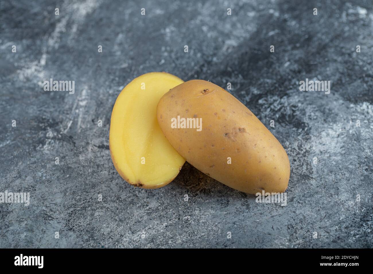 Close up photo of half or whole potatoes Stock Photo - Alamy