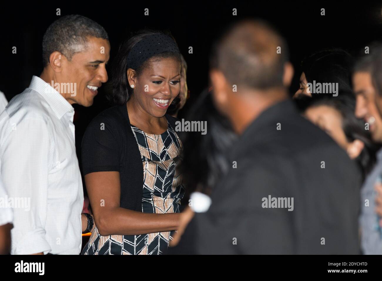 US President Barack Obama and First Lady Michelle Obama greet well ...