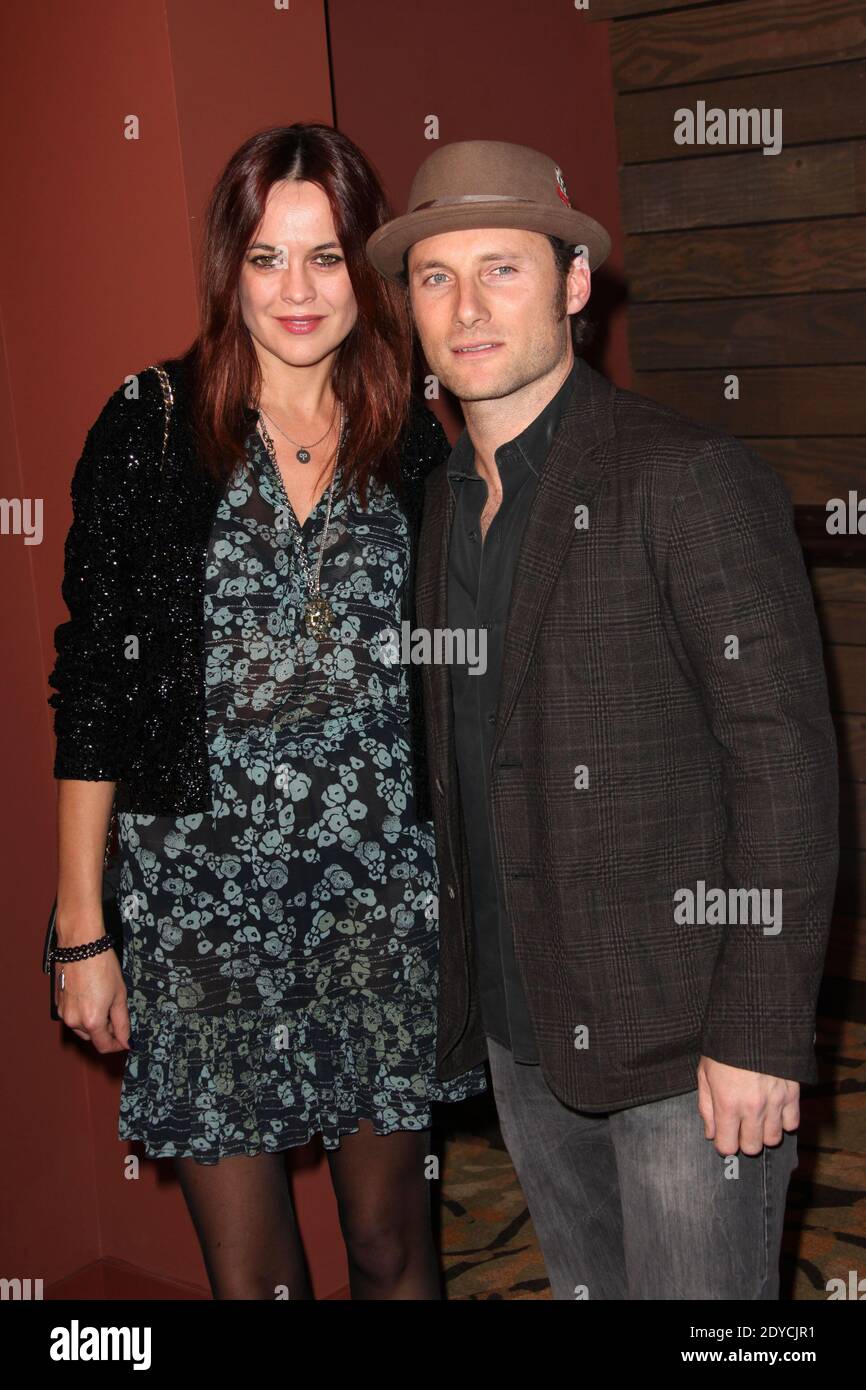 Christopher Stills and Corina Marinescu arriving to the premiere of ...