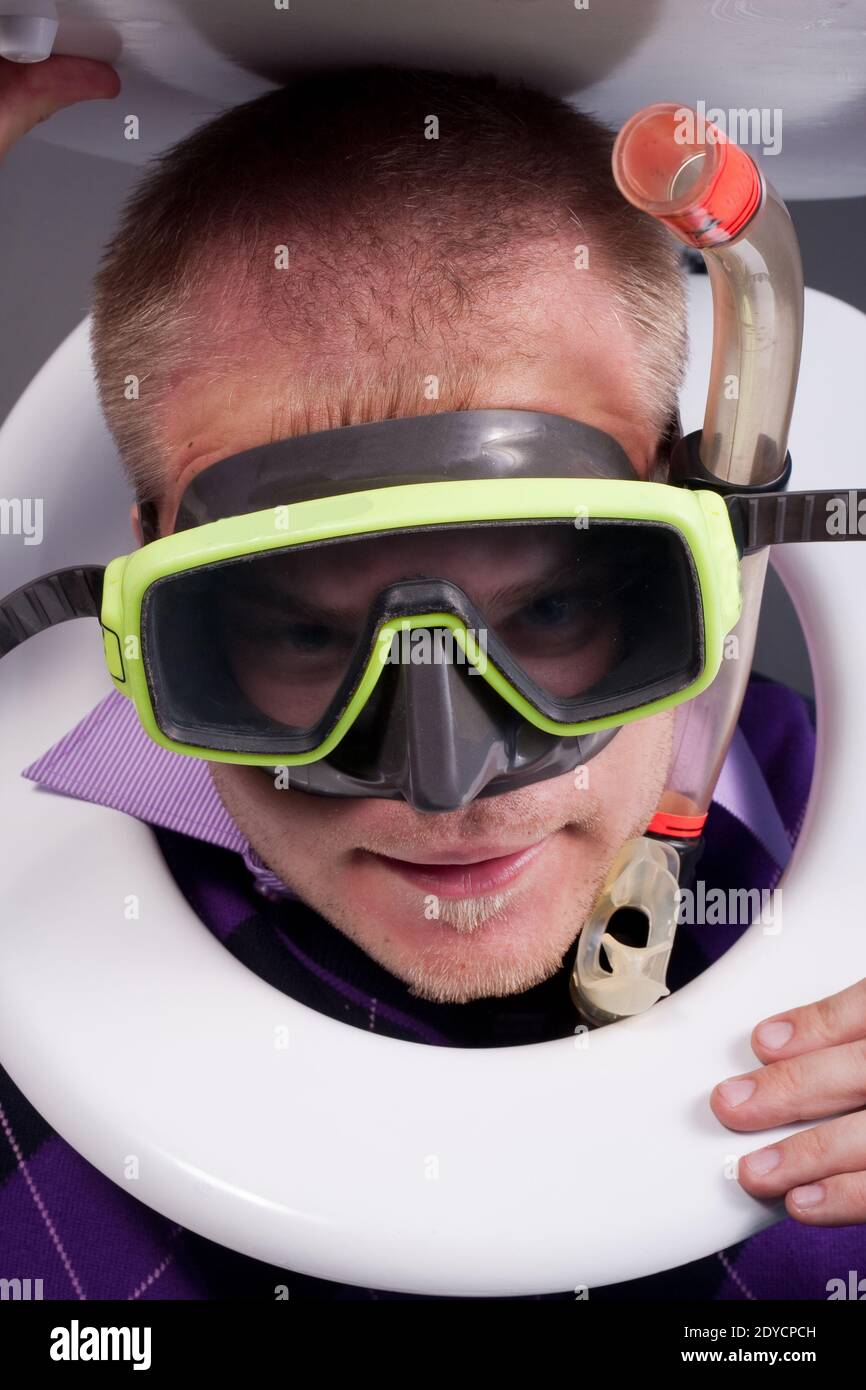 young handsome diver in toilet Stock Photo - Alamy