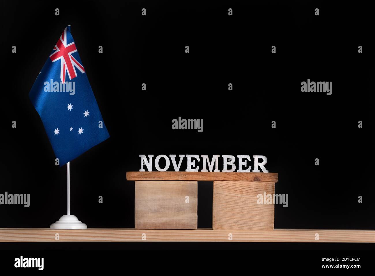 Wooden calendar of November with Australian flag on black background ...
