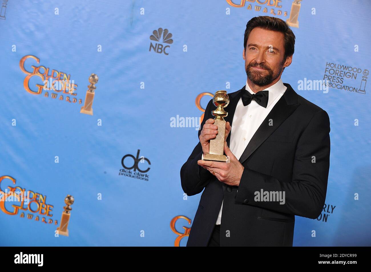 Hugh Jackman with the Golden Globe for best actor in a musical or ...