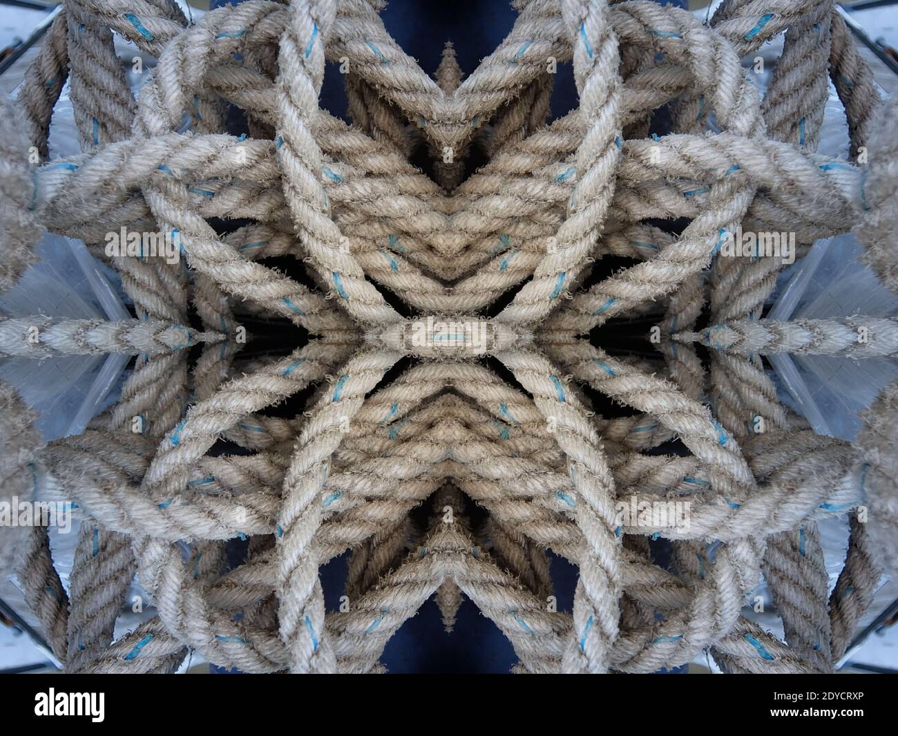 A kaleidoscope abstract pattern made of overlapping and knotted rope ...