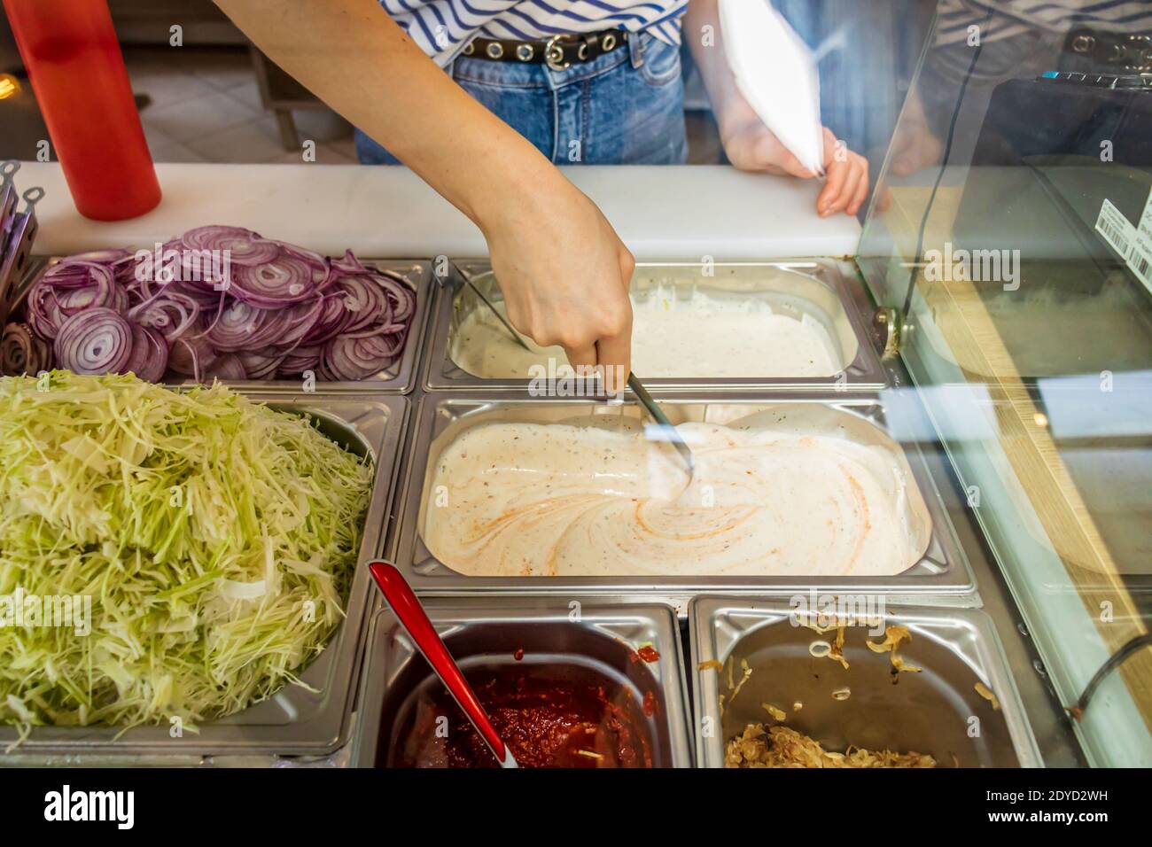 Vegetable counter at a local pizza and gyros restaurant Stock Photo - Alamy