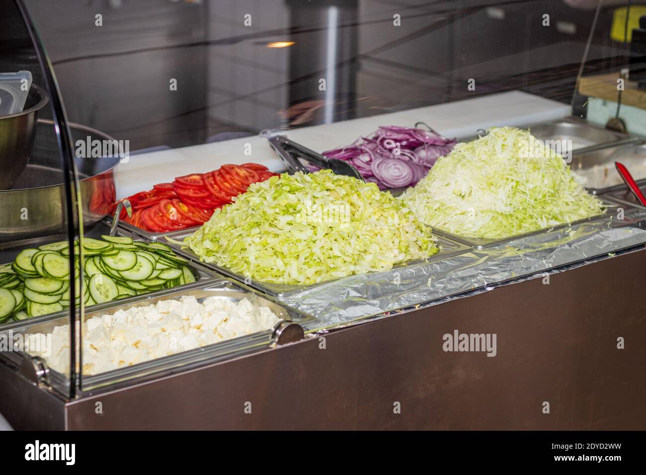 Vegetable counter at a local pizza and gyros restaurant Stock Photo - Alamy