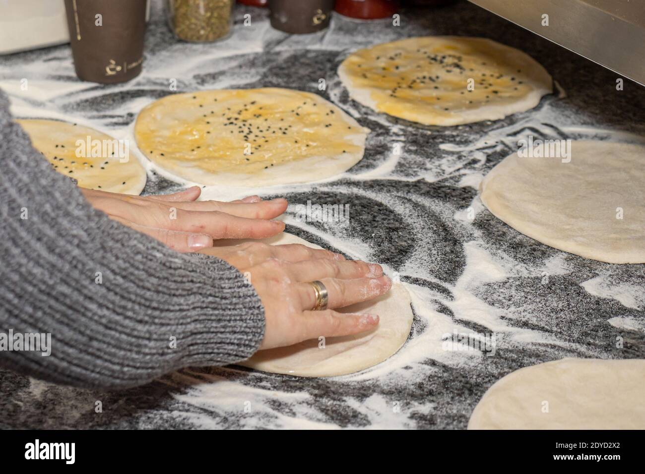 A girl making doner buns in a local pizza and gyros restaurant Stock ...