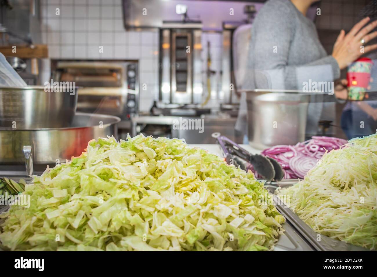 Vegetable counter at a local pizza and gyros restaurant Stock Photo - Alamy