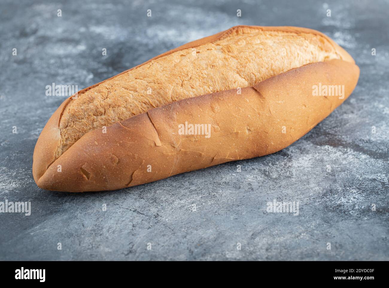 Loaf of bread on grey background Stock Photo - Alamy