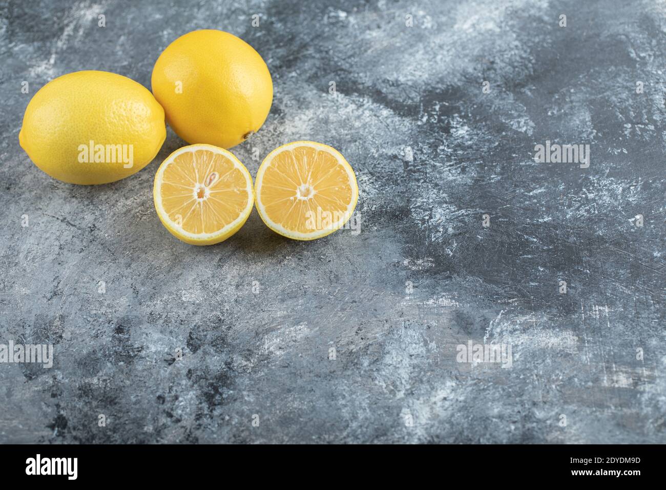 Wide angle photo of half cut and whole lemon Stock Photo - Alamy