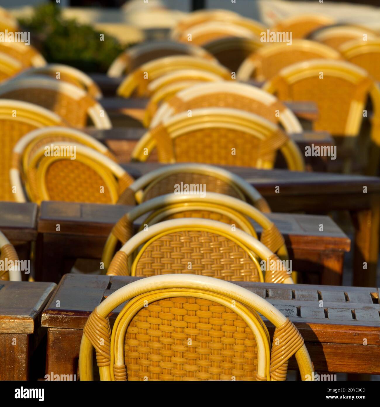 wooden chairs in an outdoor restaurant Stock Photo - Alamy