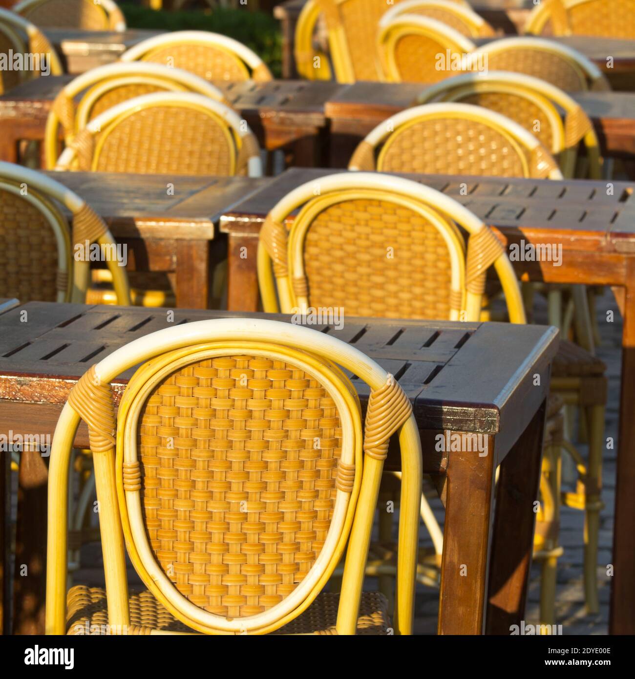 wooden chairs in an outdoor restaurant Stock Photo - Alamy
