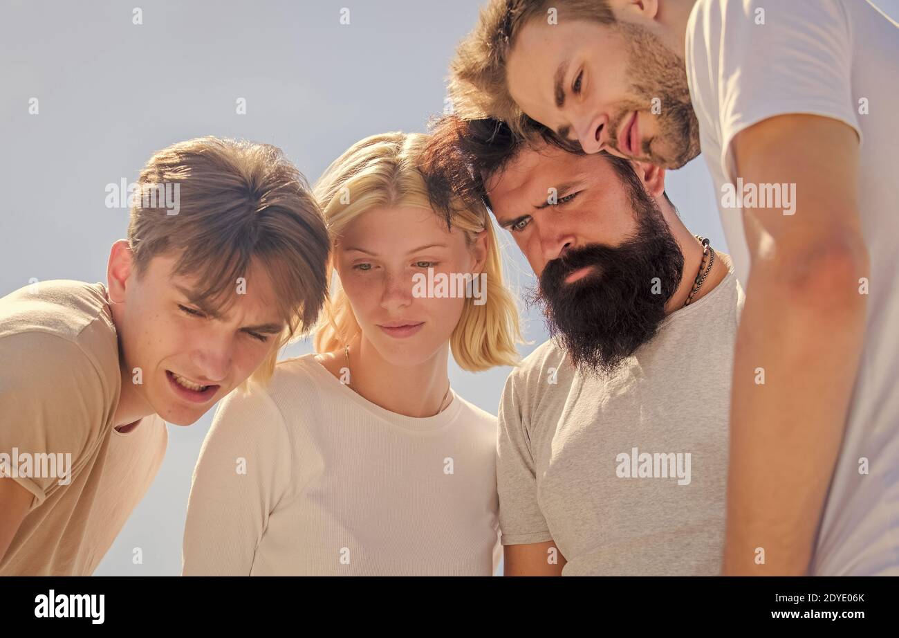 Focused on something. Whats there. Group of people with serious look ...