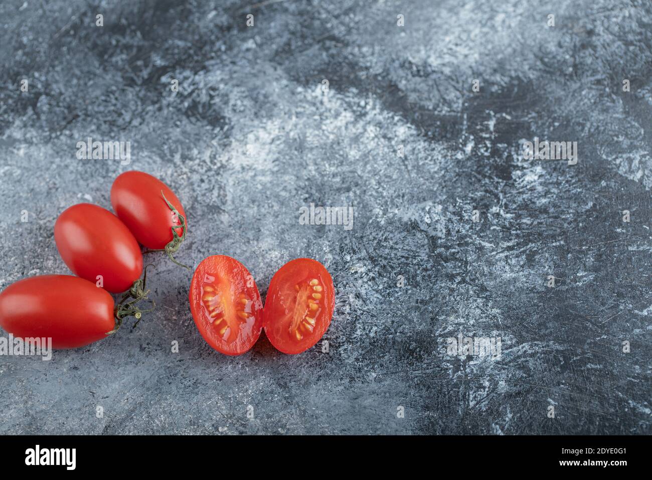 Amish paste tomatoes half cut or whole Stock Photo - Alamy