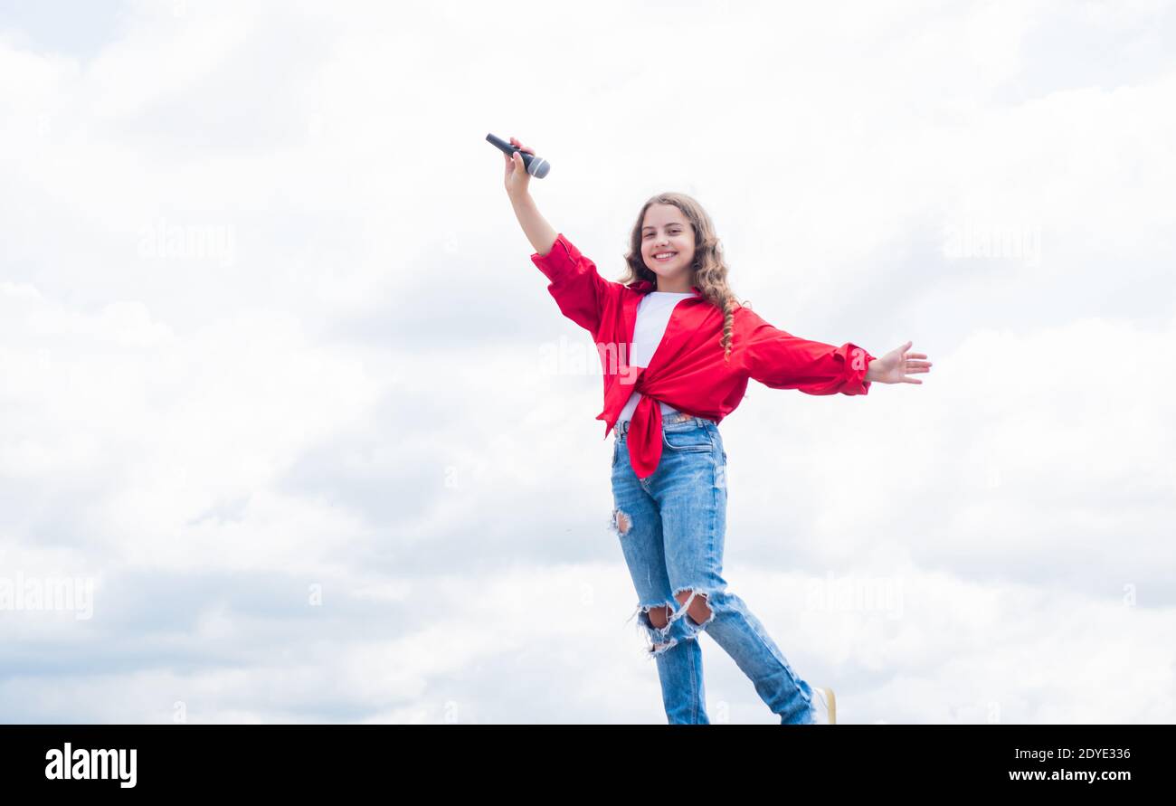 cheerful child singer singing in microphone music style, vocal Stock ...