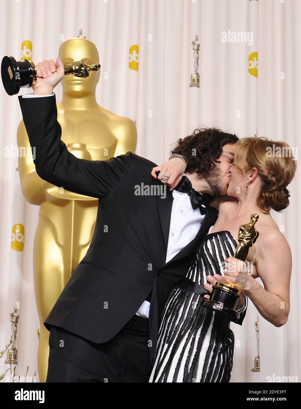 Sean Fine and Andrea Nix Fine pose in the press room during the 85th ...