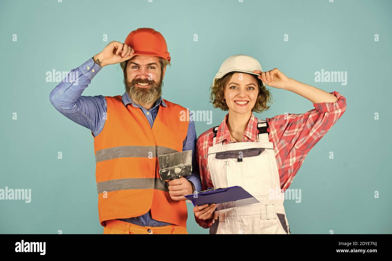 Worker show house design. couple discussing blueprint at home. real ...