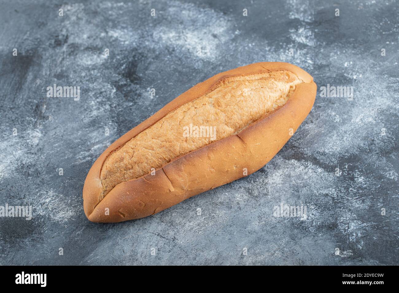 Loaf of bread on grey background Stock Photo - Alamy