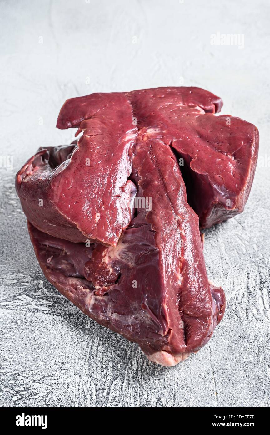 Fresh raw beef liver offal. White background. Top view Stock Photo - Alamy