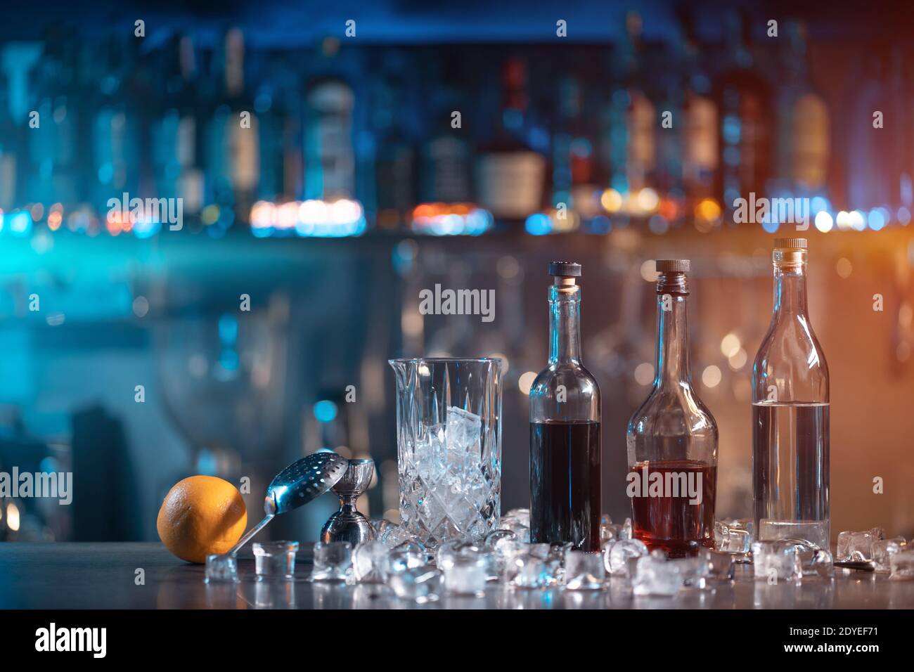 set of ingredient for negroni cocktail with ice, orange, rum, vodka and ...