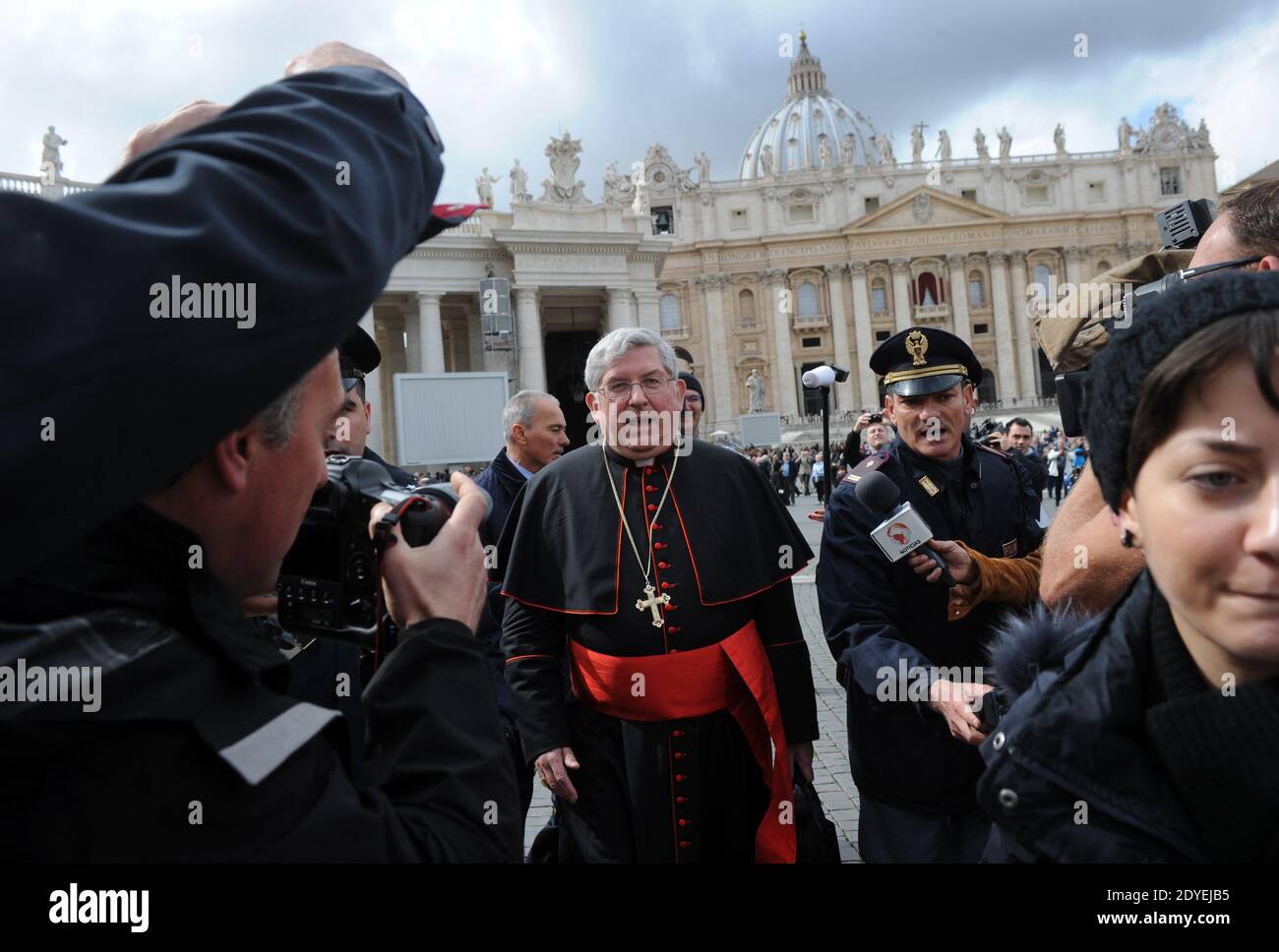 Canadian Cardinal Thomas Christopher Collins is followed by policemen ...