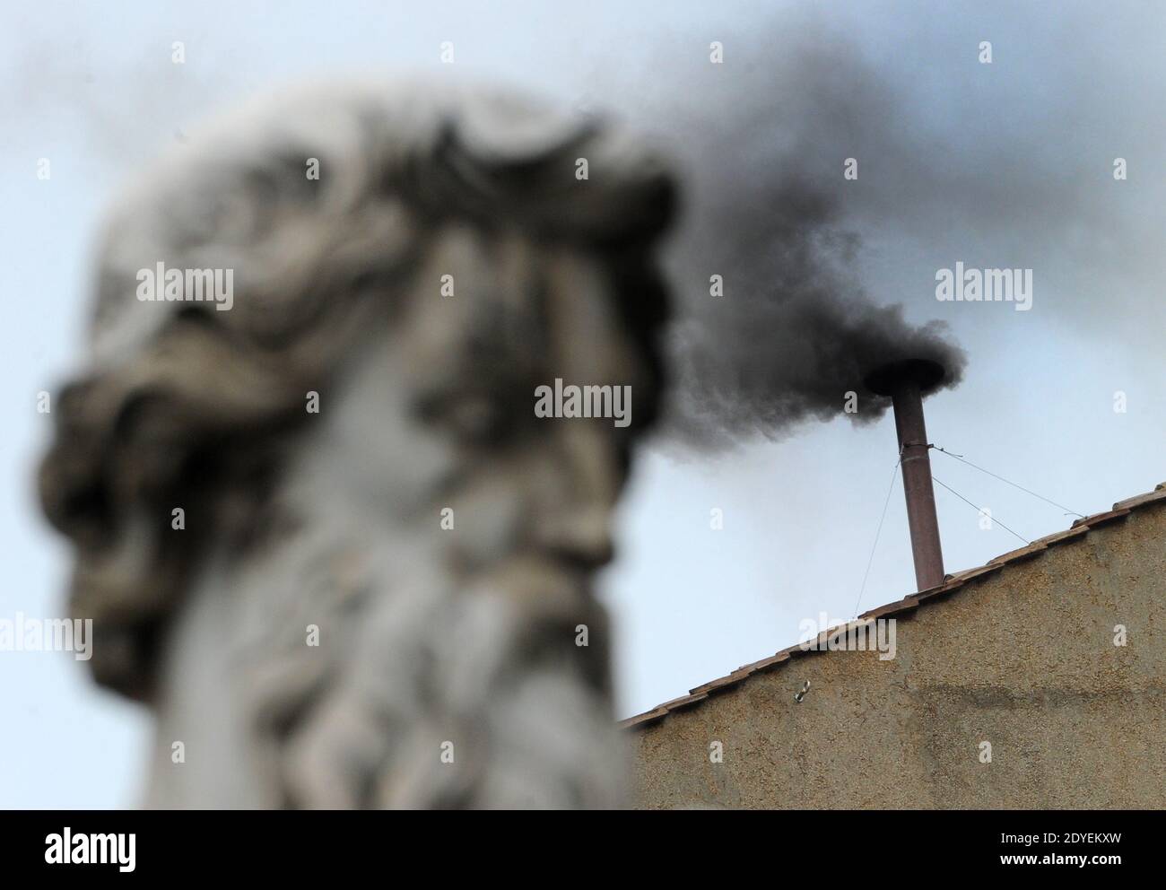 Black smoke billows from the chimney of the Sistine Chapel, meaning ...