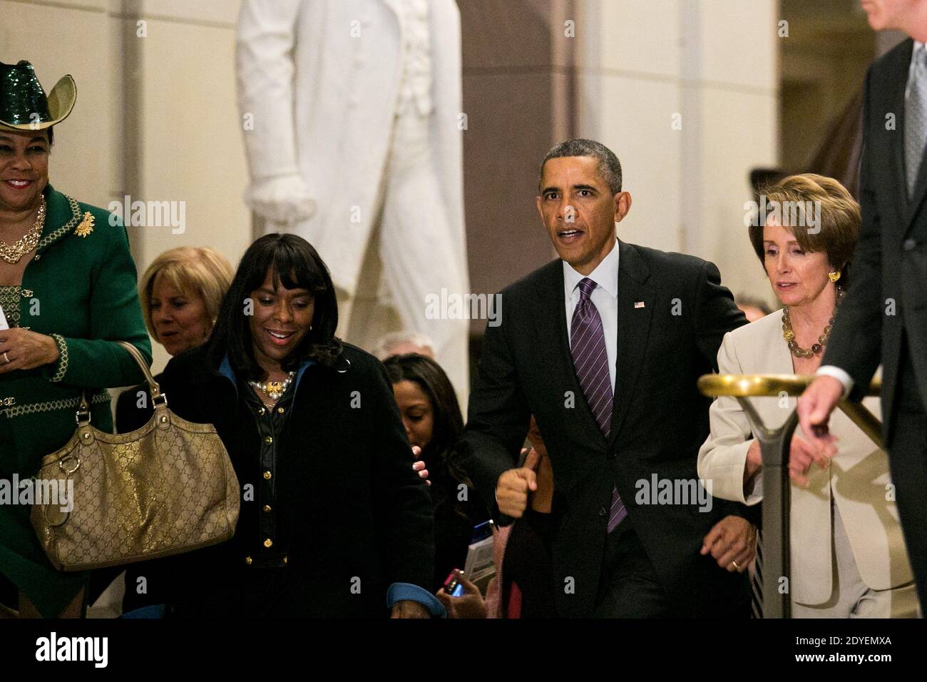 President Barack Obama, walking with House Minority Leader Nancy Pelosi ...