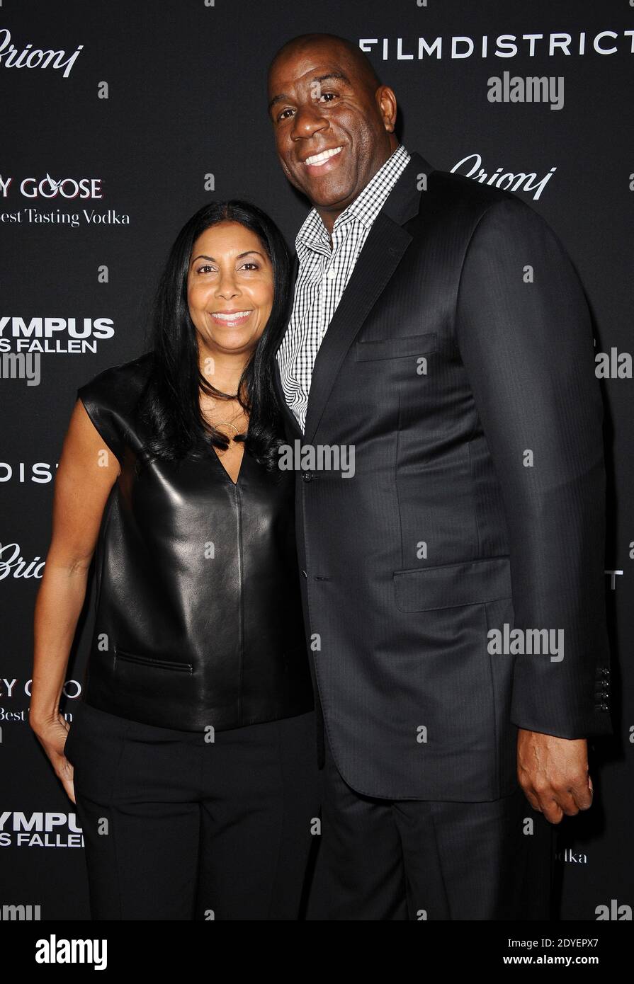 Magic Johnson and Cookie Johnson attend the premiere of Olympus Has ...