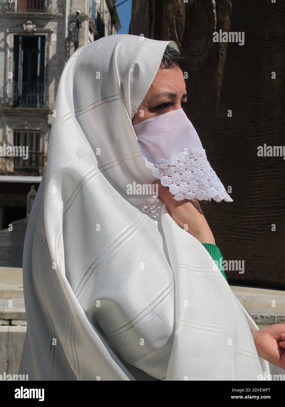 Algerian women wearing their traditional islamic outfits take part in a ...