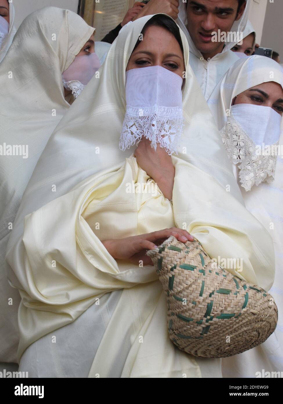 Algerian women wearing their traditional islamic outfits take part in a ...
