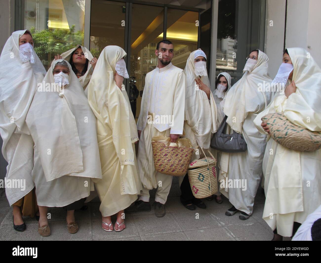 Algerian women wearing their traditional islamic outfits take part in a ...