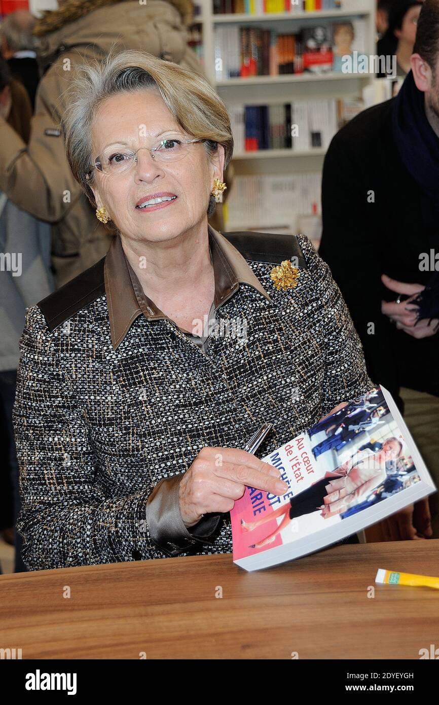 Michele Alliot-Marie signing copies of her book during the 33rd Salon ...