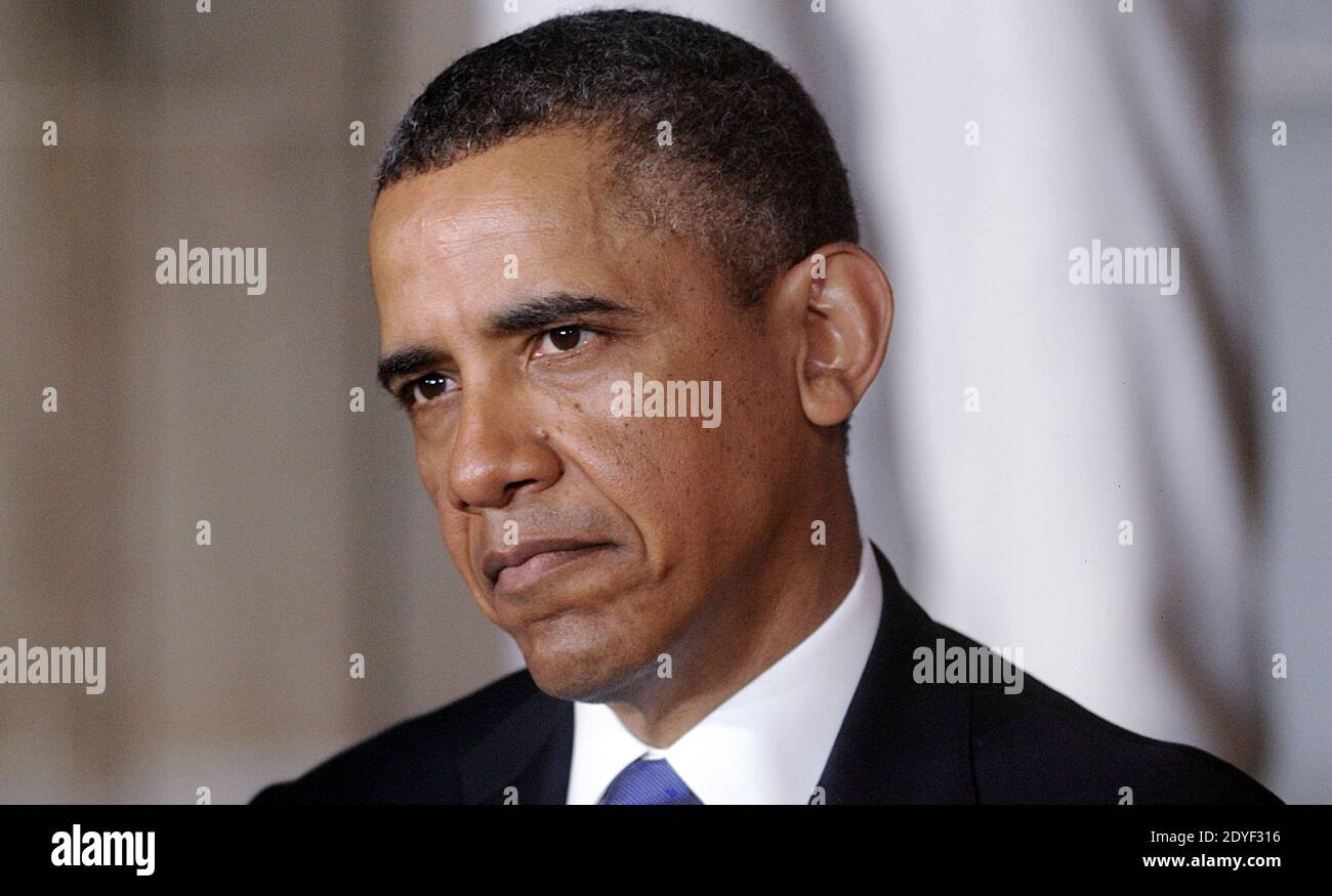 United States President Barack Obama looks on during the unveiling of a ...