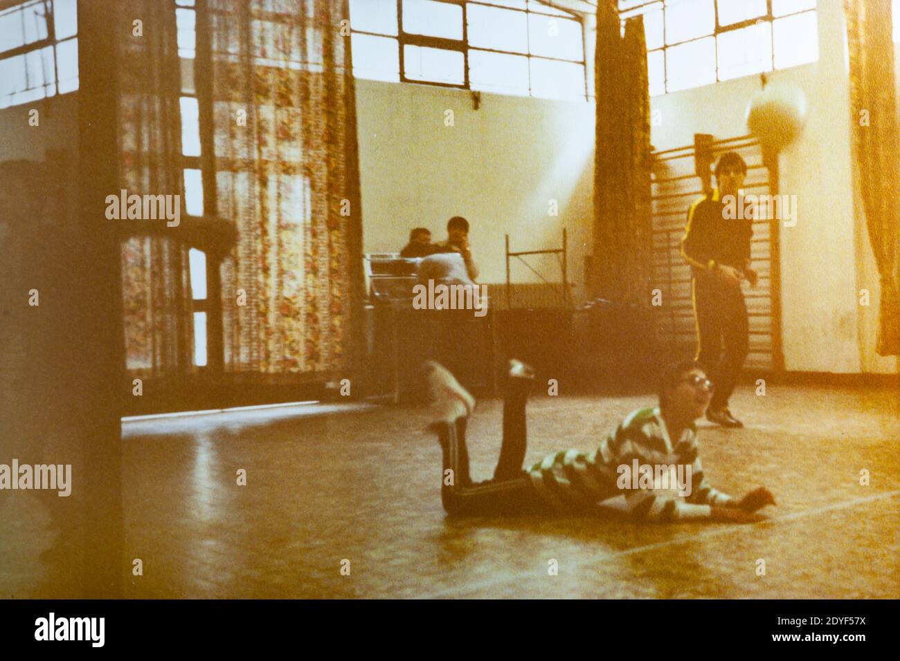 MILAN, ITALY 18 AUGUST 1975: Kids play volleyball in the school gym ...