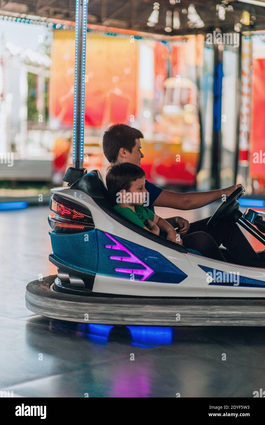 Happy little kids having fun on outdoor amusement park Stock Photo - Alamy